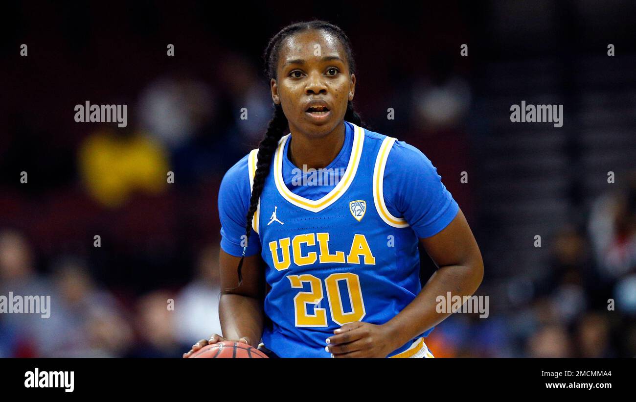 UCLA guard Charisma Osborne (20) dribbles the ball against Connecticut ...
