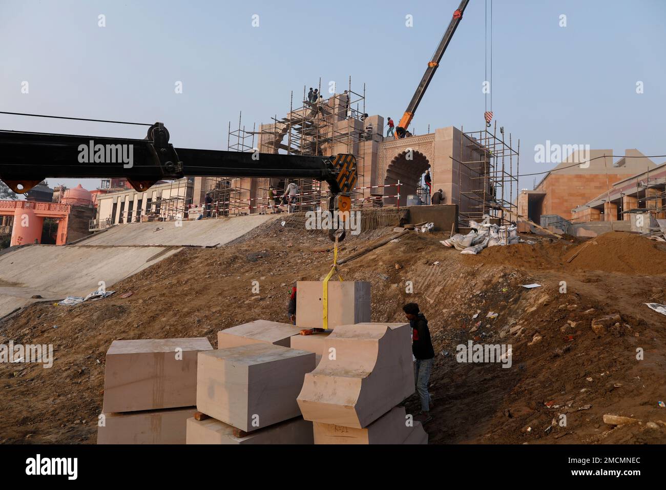 Laborers work at the under-construction Kashi Vishwanath Dham Corridor ...