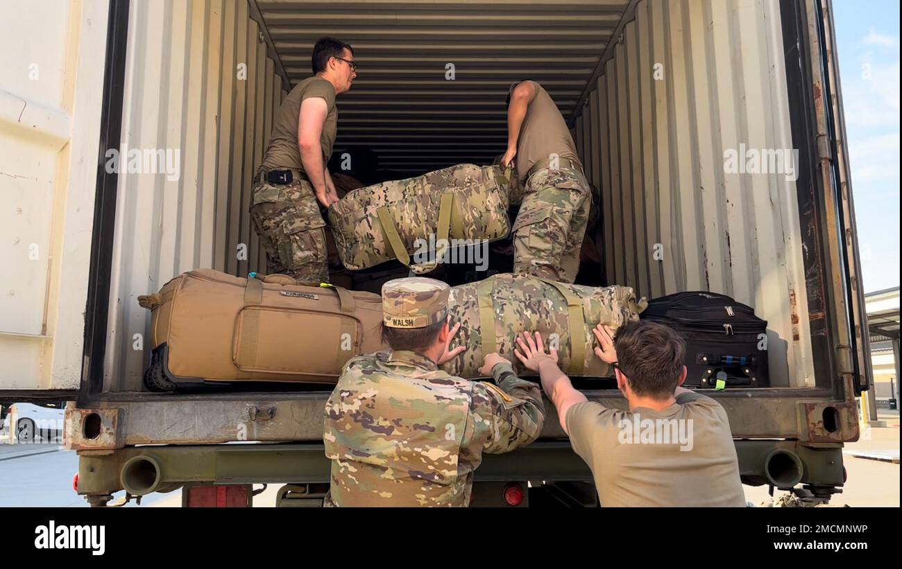 Soldiers from 101st Airborne Division (Air Assault), load bags in a ...