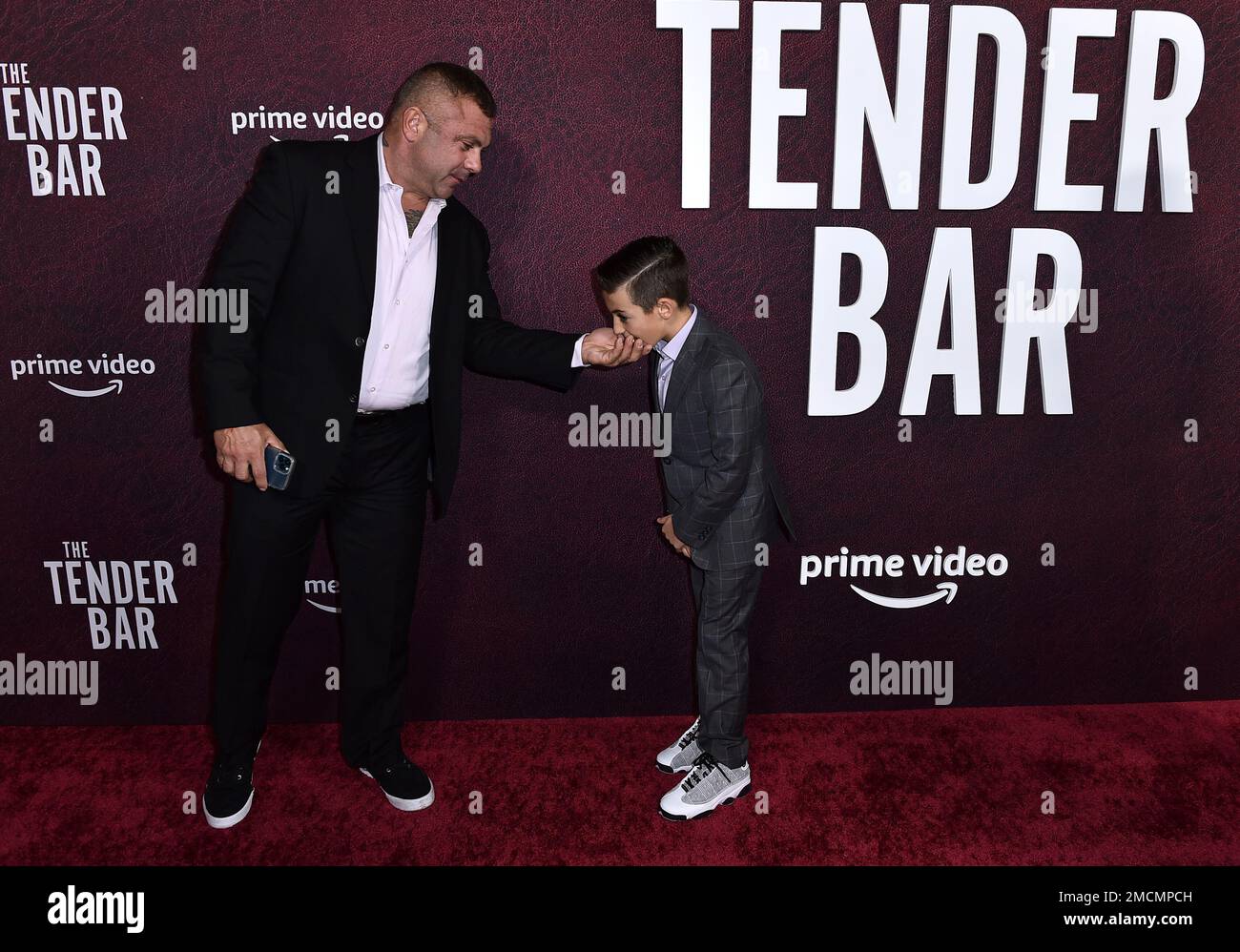 Daniel Ranieri spits a piece of gum out into his father's hand at the ...