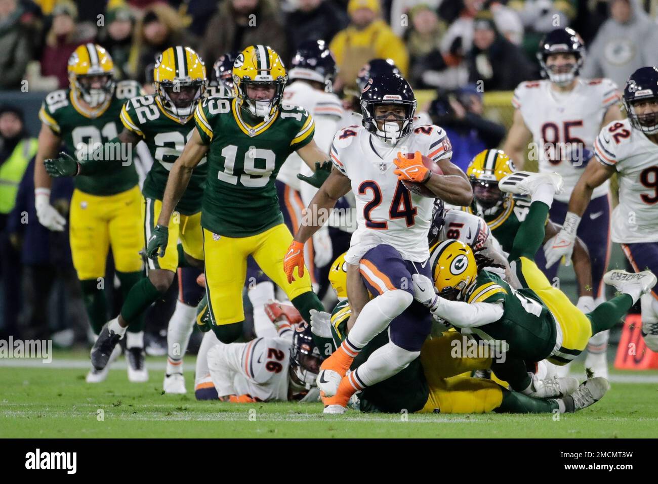 Chicago Bears' Khalil Herbert is stopped by Green Bay Packers' Kevin ...