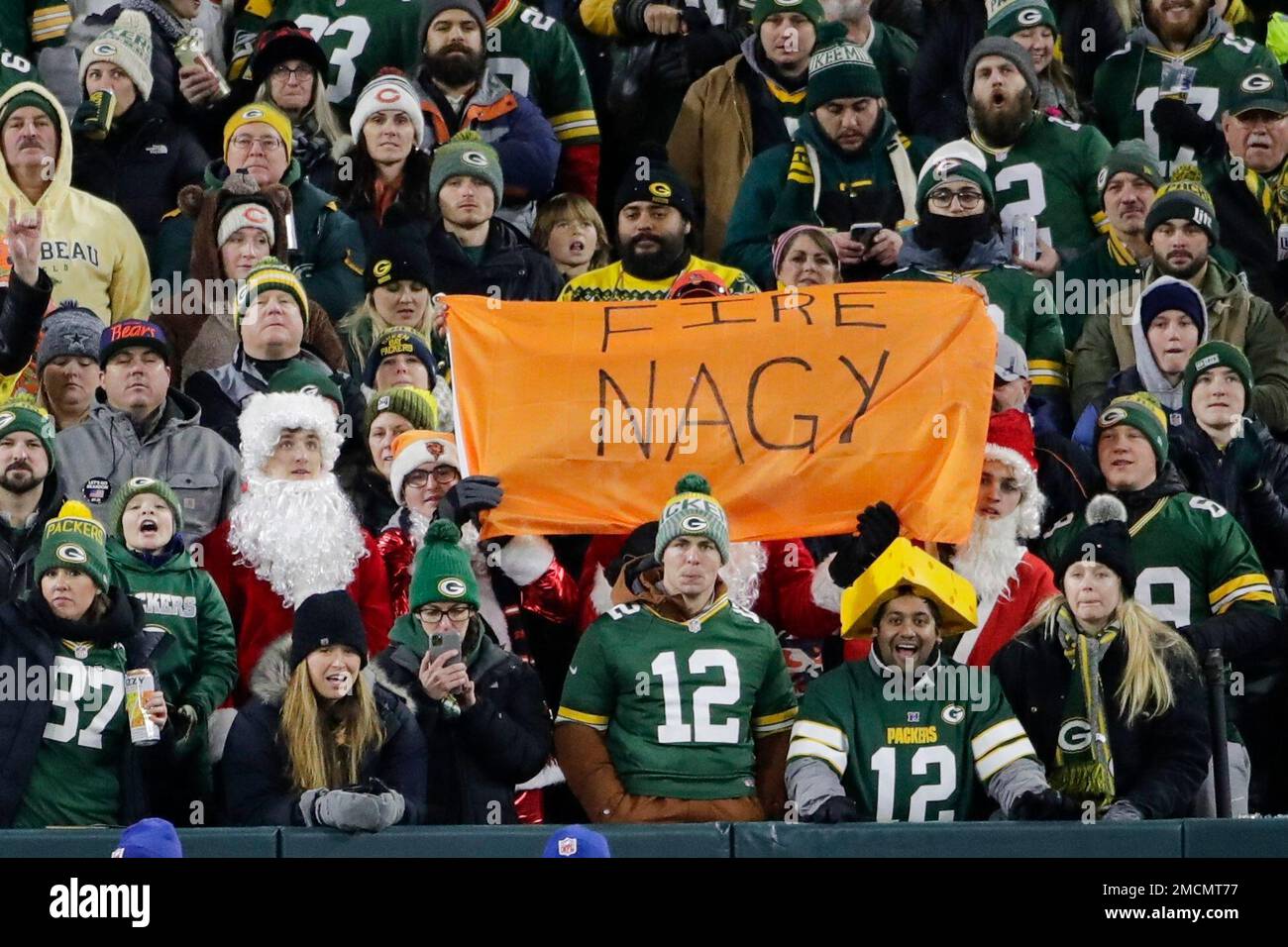Fans hold up a signs to fire Chicago Bears head coach Matt Nagy during ...