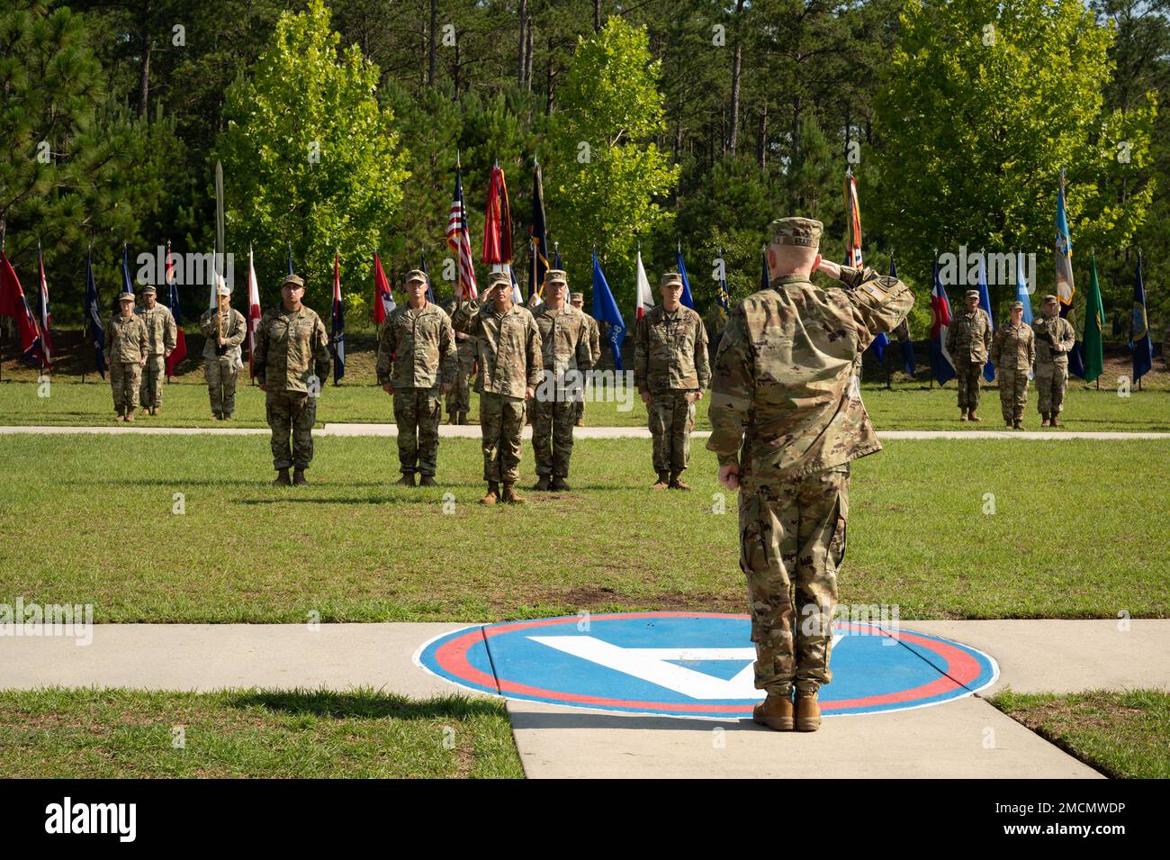 Lt. Gen. Patrick D. Frank renders a salute and orders the colors to be ...