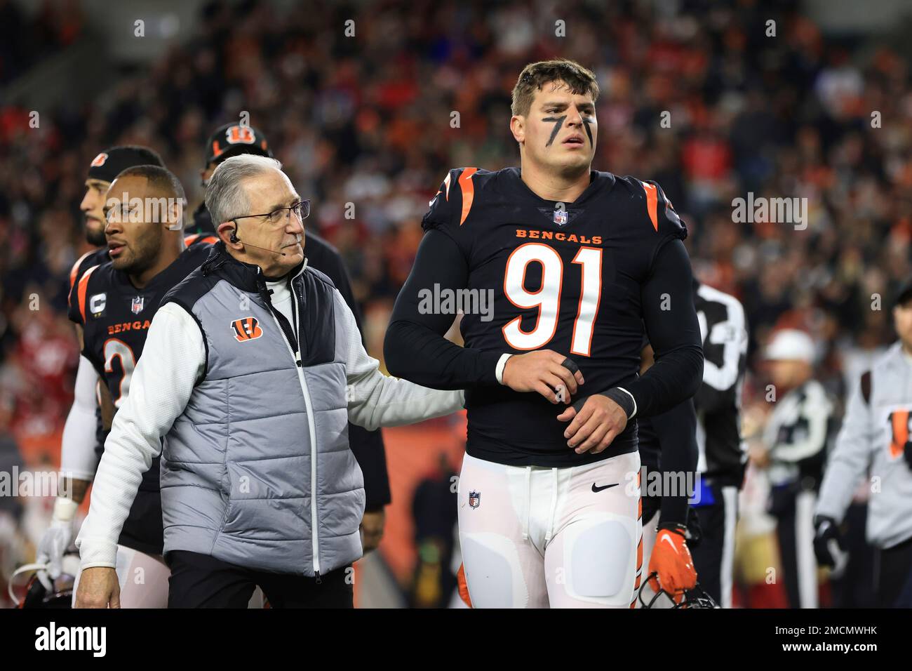 Cincinnati Bengals' Trey Hendrickson (91) is helped off the field ...