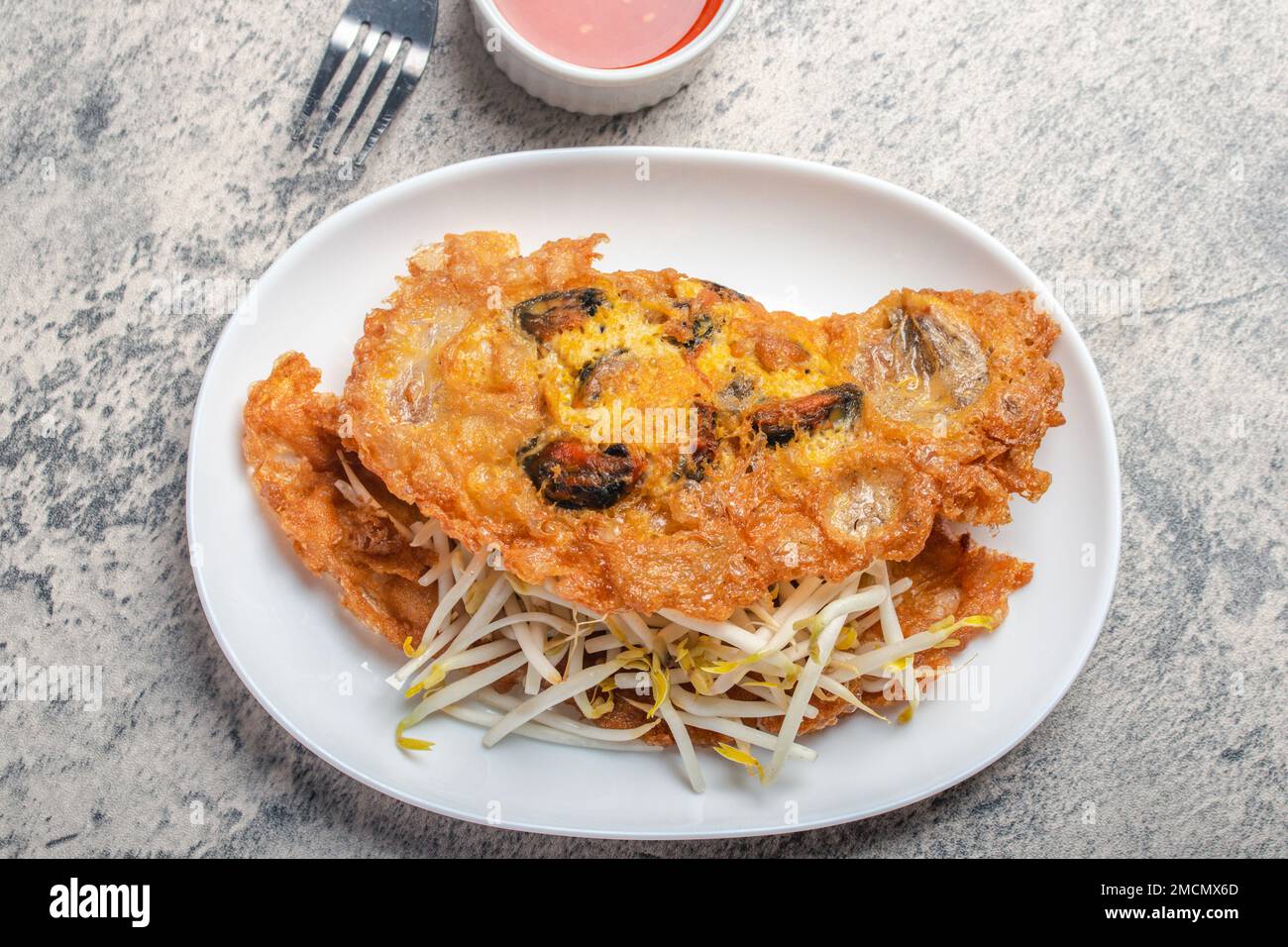 Fried mussels in crispy batter in a white plate Stock Photo - Alamy