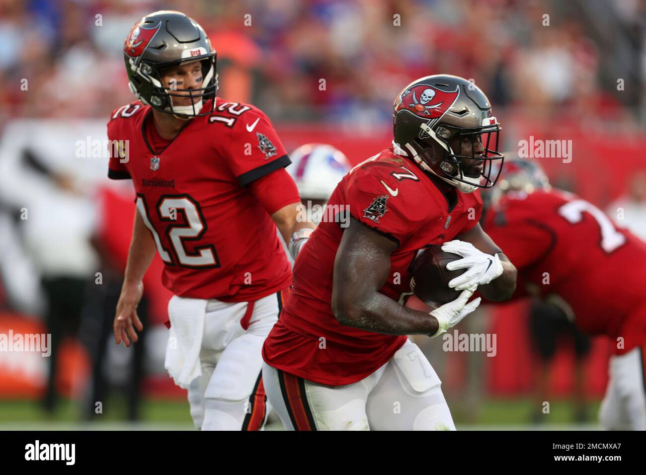 Tampa Bay Buccaneers running back Leonard Fournette (7) takes the ball ...