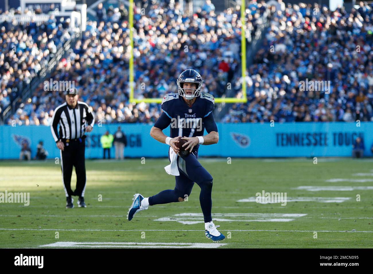 Tennessee Titans quarterback Ryan Tannehill (17) heads to the end zone ...