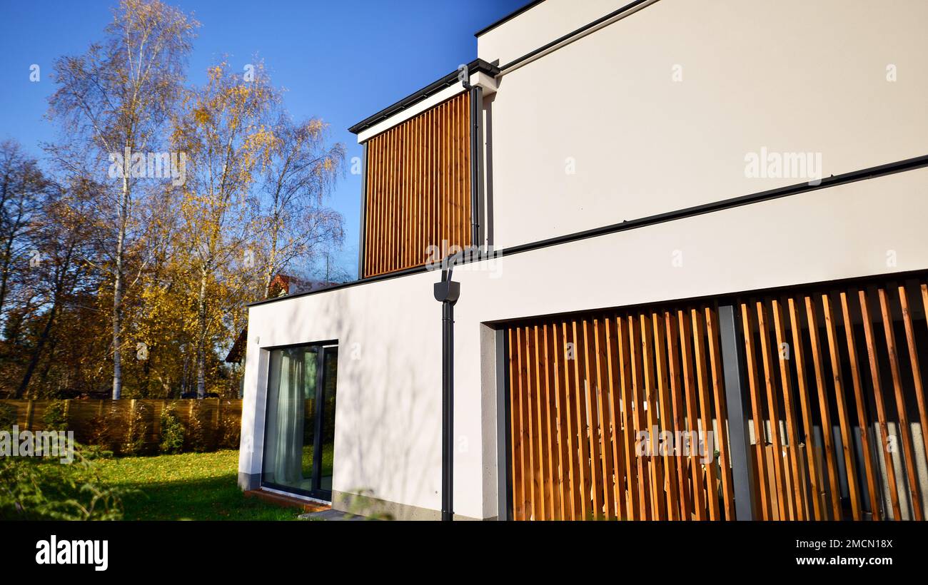 Cubist architecture. Cozy and modern house with garage and cobblestone ...