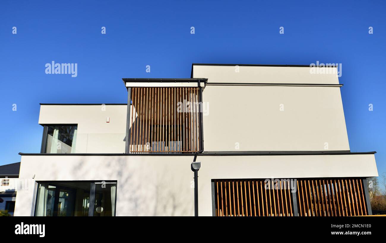 Cubist architecture. Cozy and modern house with garage and cobblestone ...