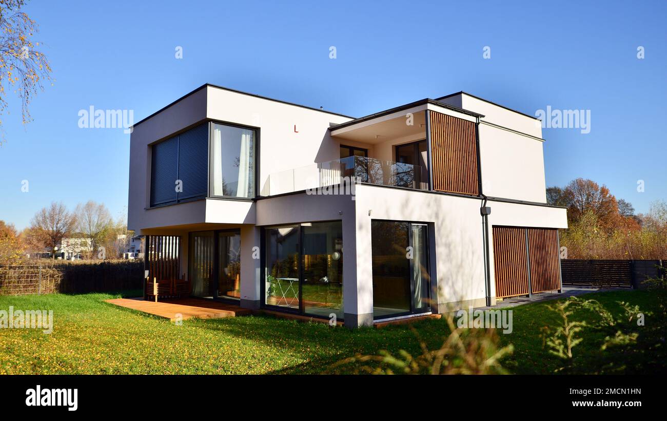 Cubist architecture. Cozy and modern house with garage and cobblestone ...