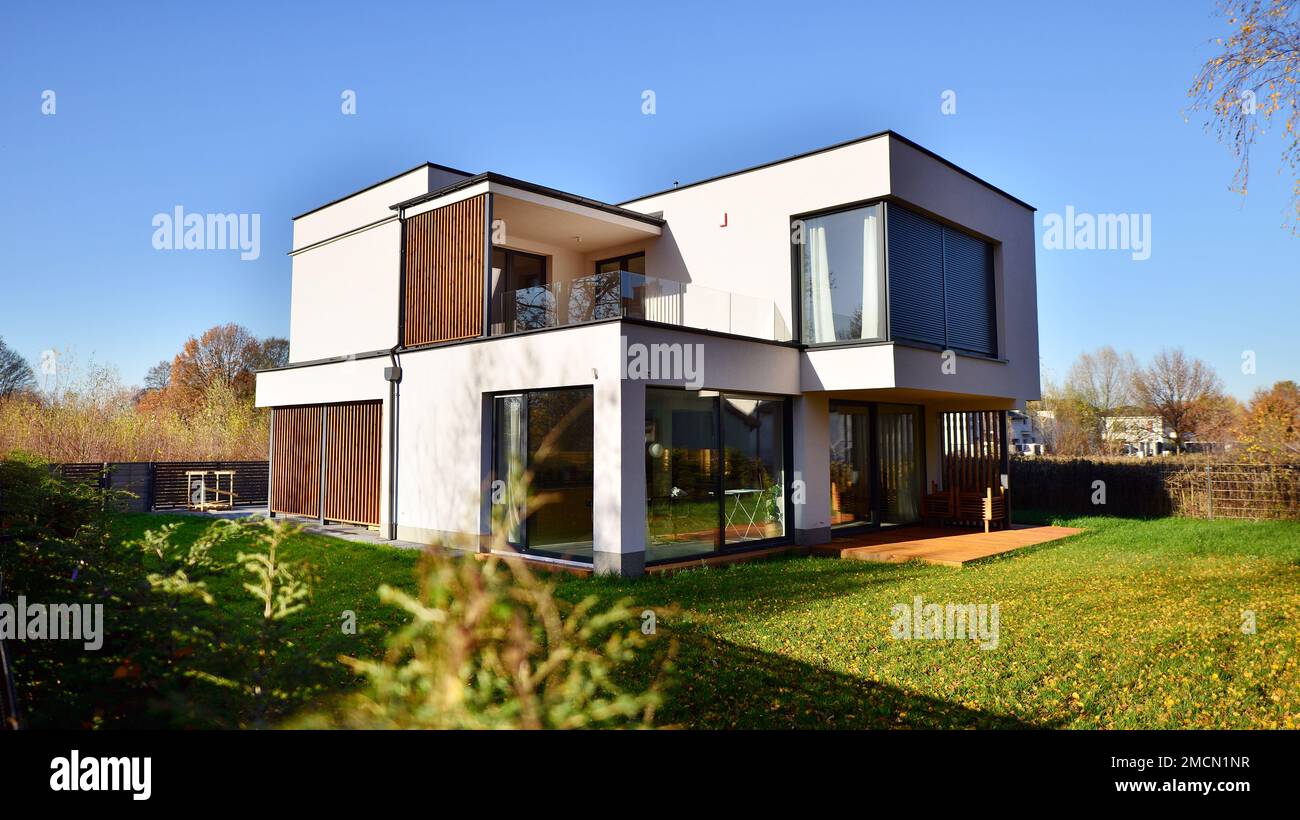 Cubist architecture. Cozy and modern house with garage and cobblestone ...