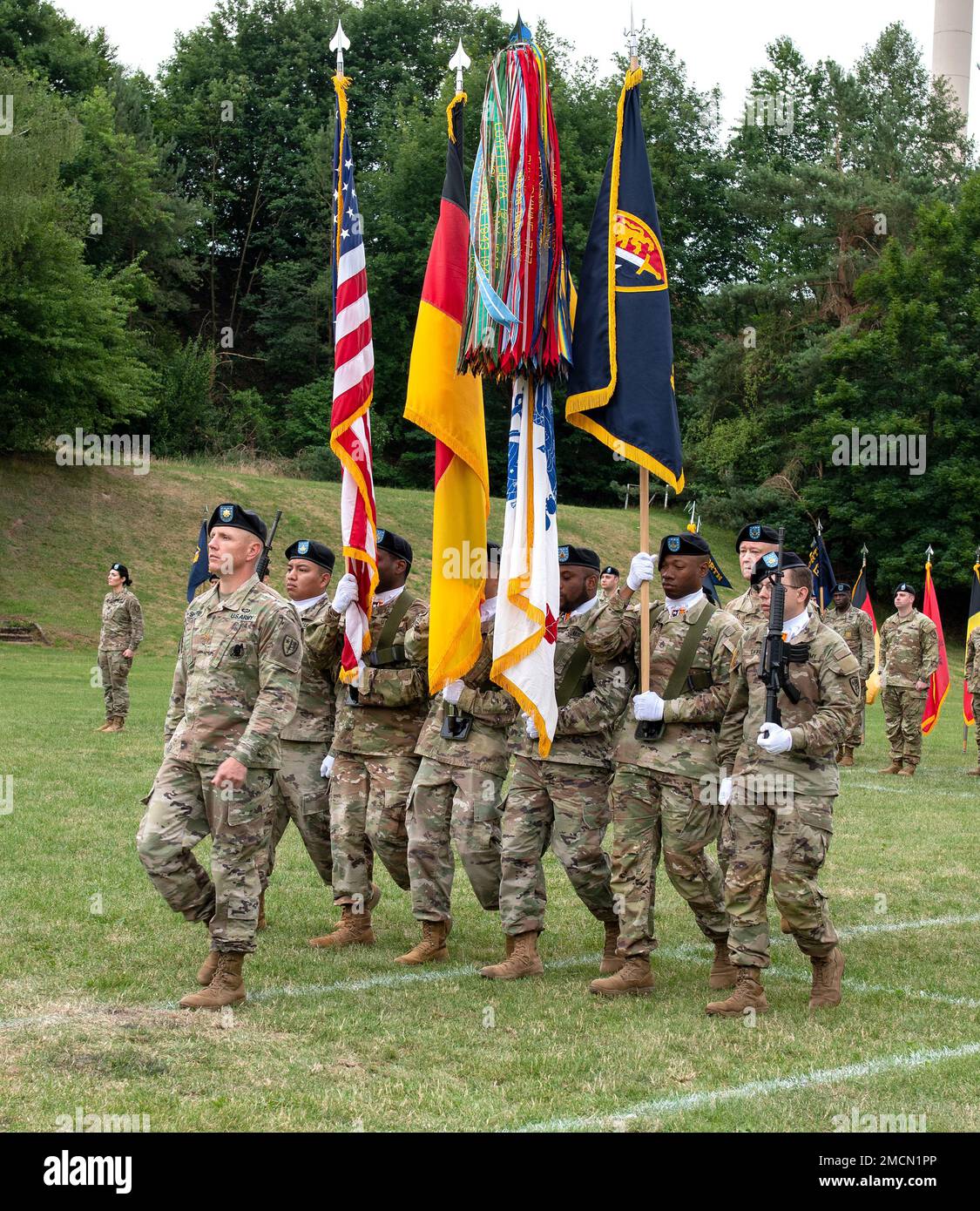 U.S. Army Maj. Scott Shaffer, commander of troops, leads the colors ...