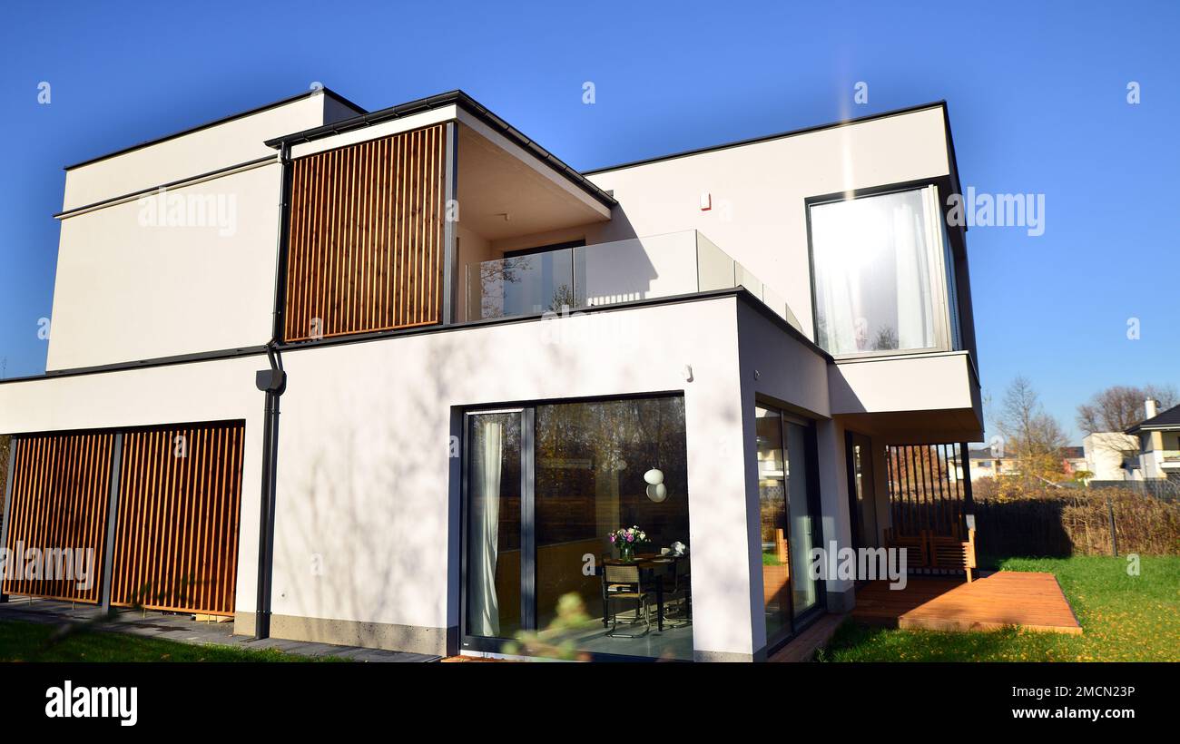 Cubist architecture. Cozy and modern house with garage and cobblestone ...