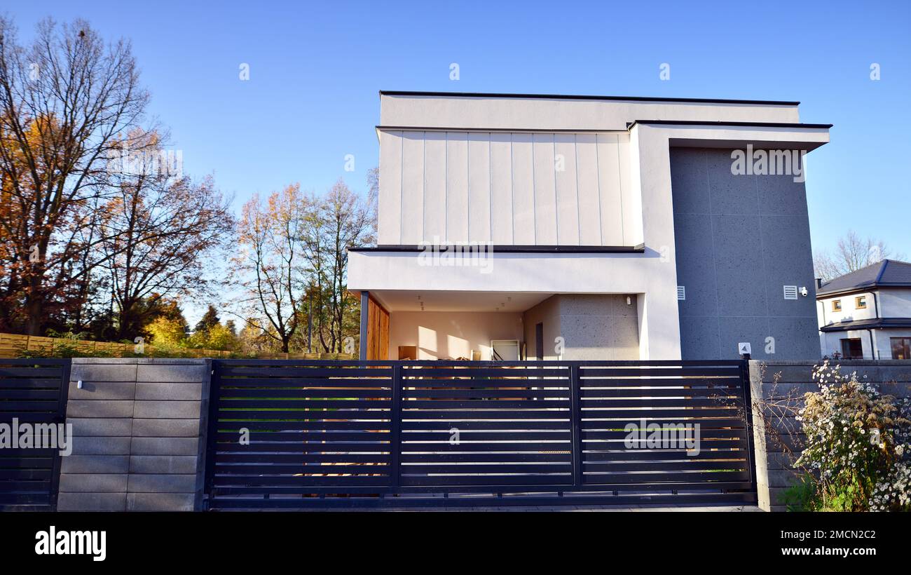 Cubist architecture. Cozy and modern house with garage and cobblestone ...