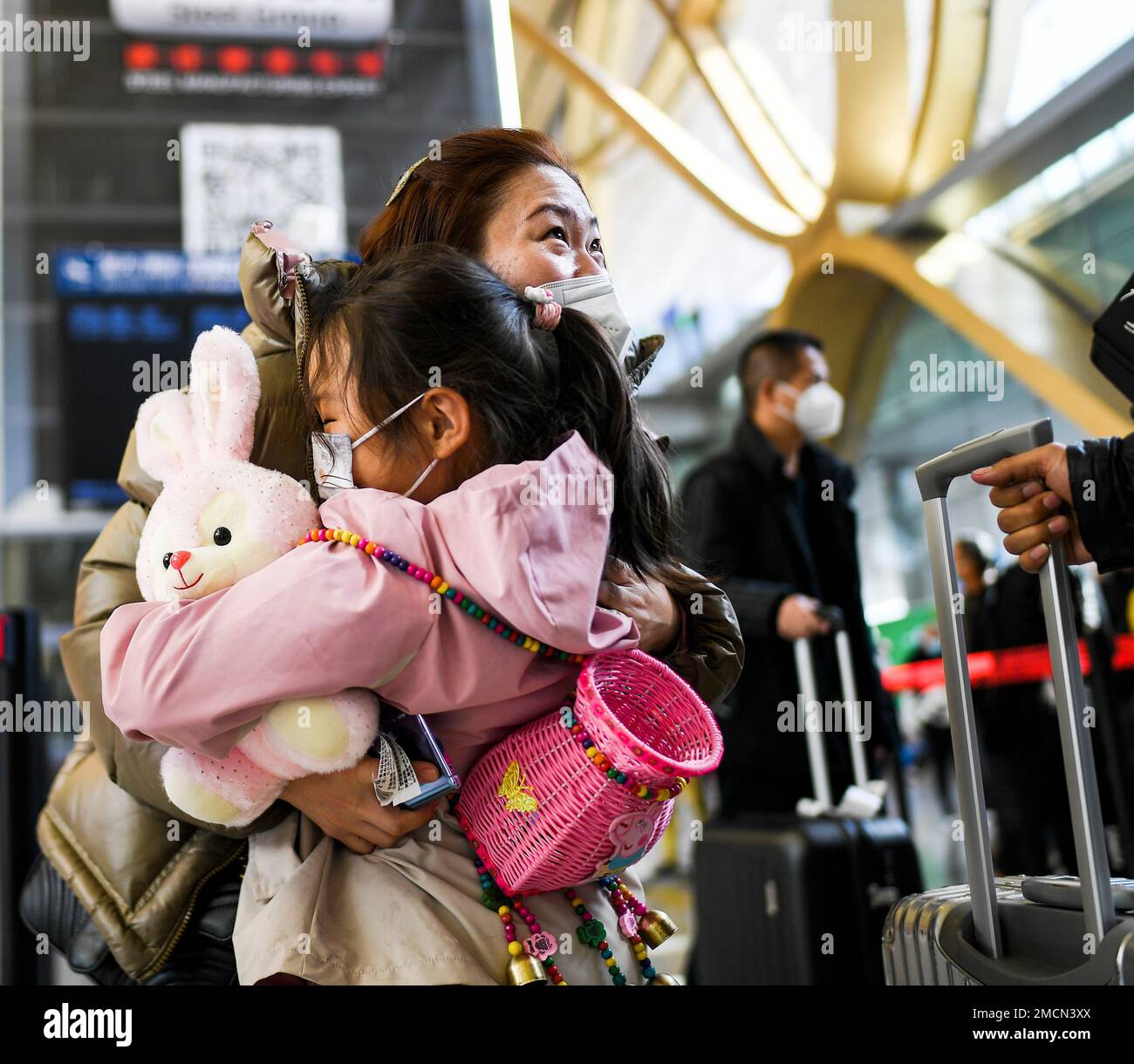 Beijing, China's Yunnan Province. 15th Jan, 2023. A woman hugs her ...