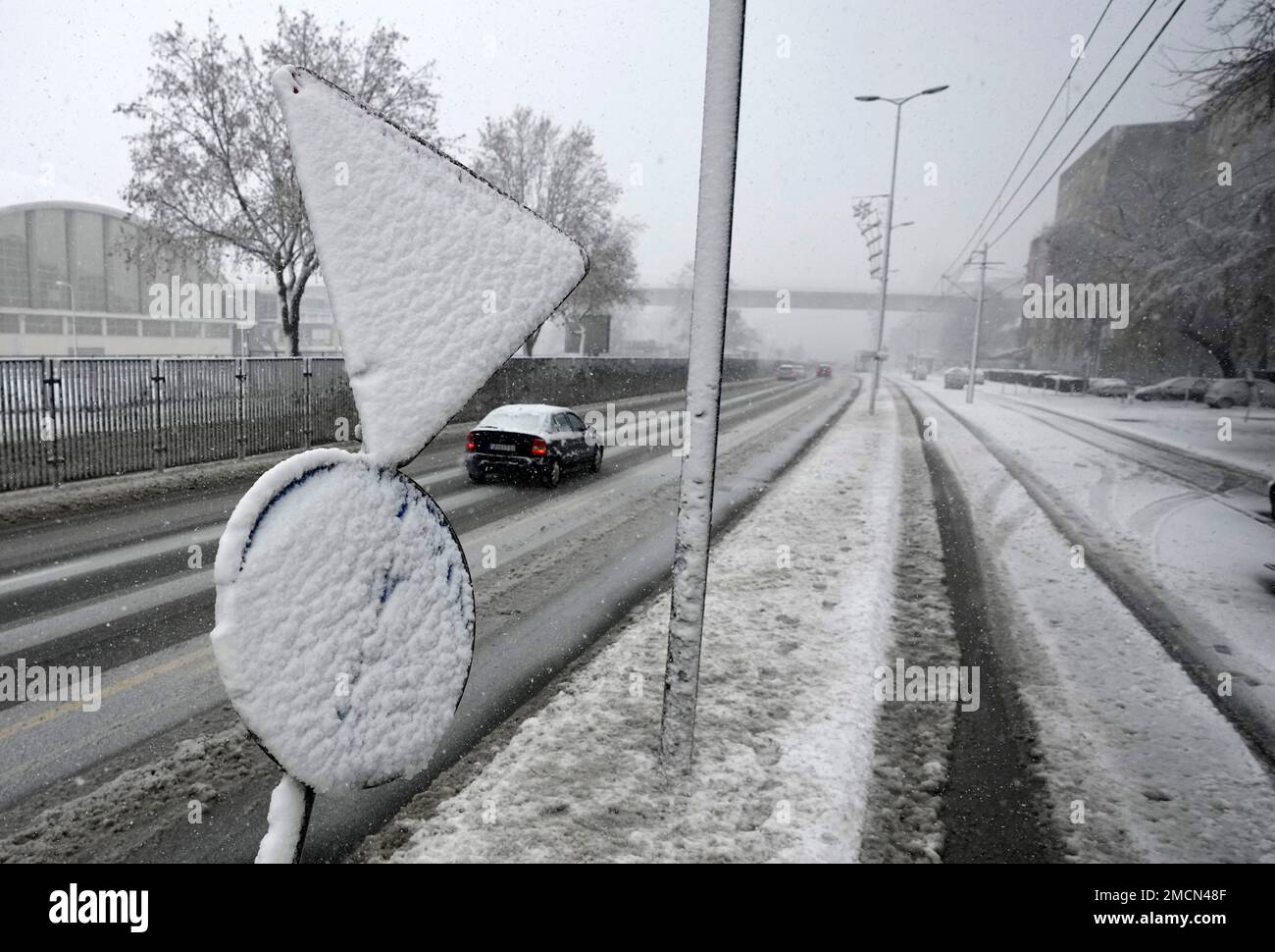 Cars on the street during snow storm in Belgrade, Serbia, Sunday, Dec ...
