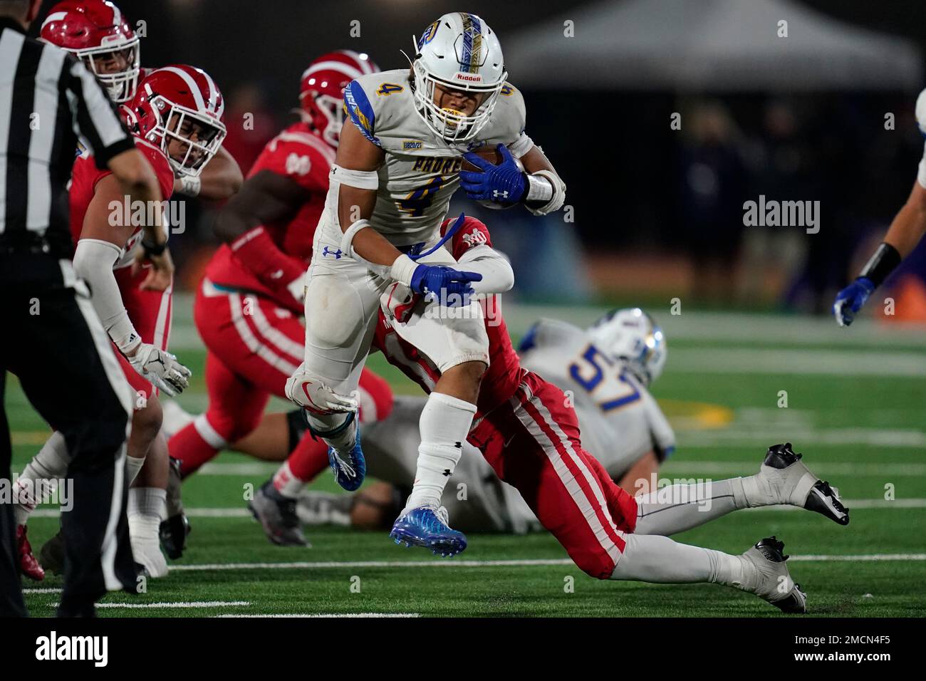 Mater Dei safety Joshua Hunter (14) tackles Serra running back/middle ...