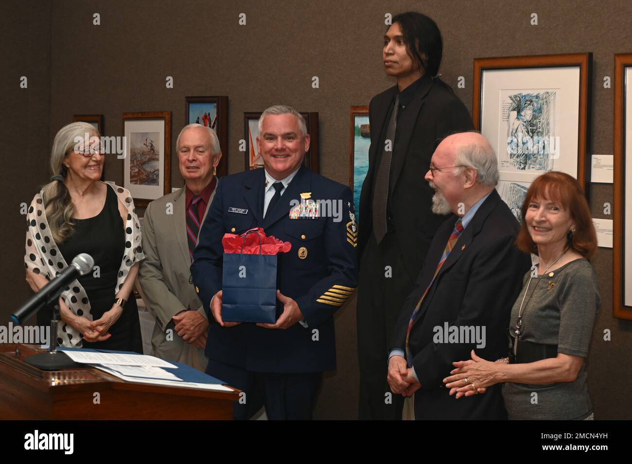 U.S. Coast Guard District 1 Command Master Chief Michael Ingham accepts ...