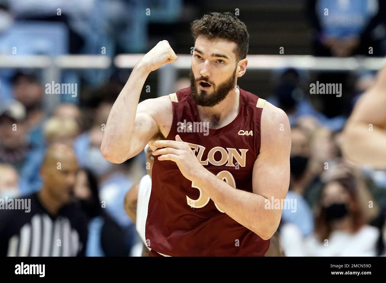 Elon center Andrew Junkin (30) reacts following a basket against North ...