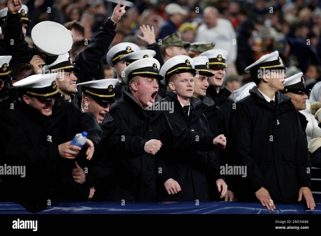 Navy midshipmen cheer during the second half of an NCAA college ...