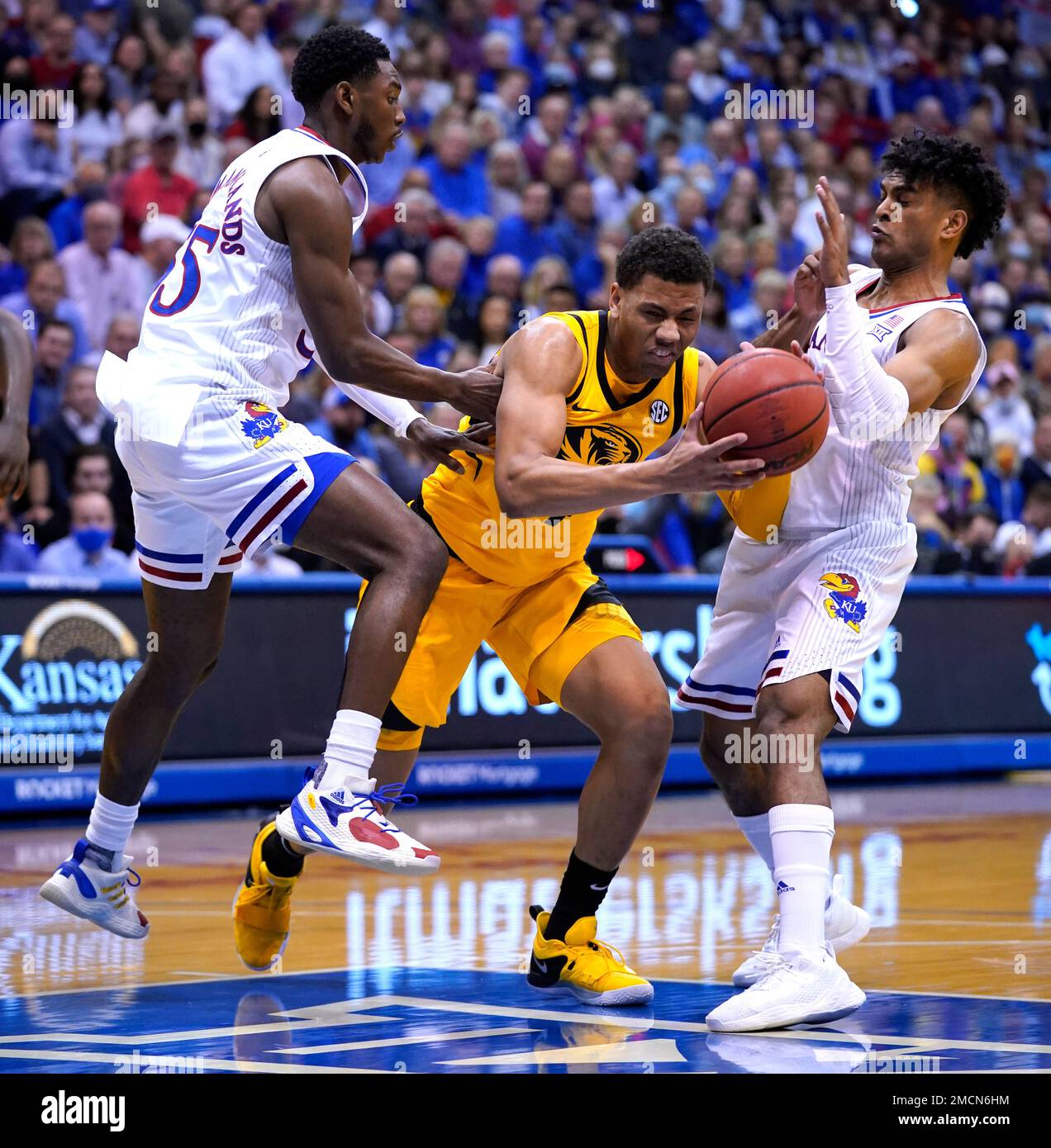 Missouri guard Javon Pickett, center, drives the lane against Kansas ...