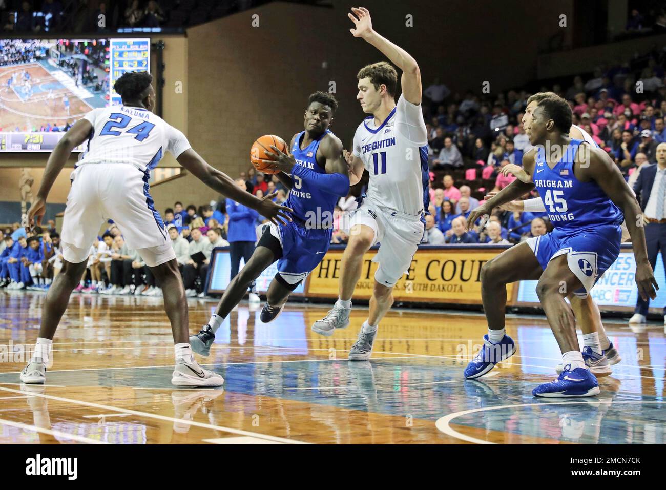 BYU Forward Gideon George (5) drives against Creighton defender Ryan ...
