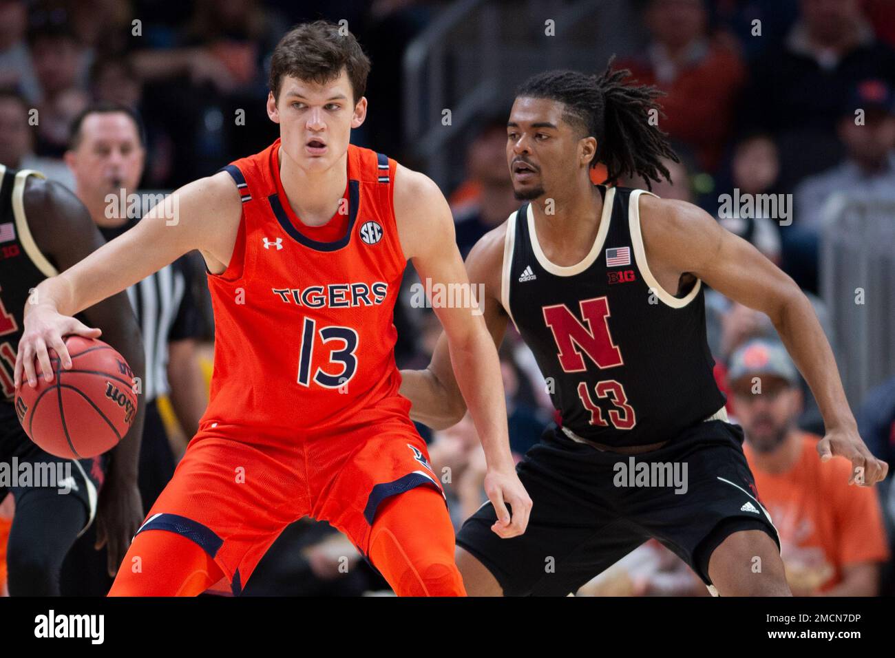 Nebraska forward Derrick Walker (13) defends as Auburn forward Walker ...