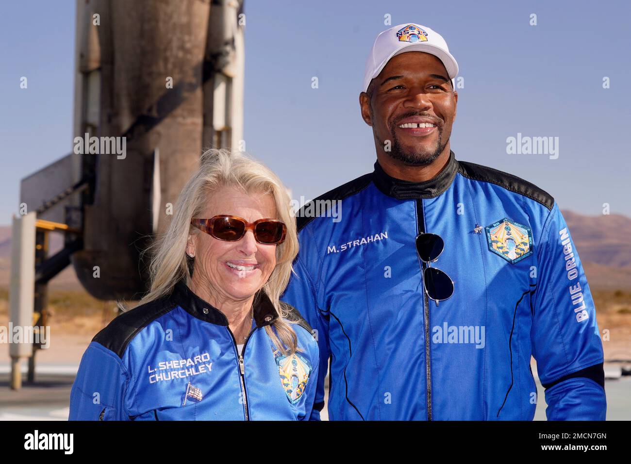 TV celebrity and former NFL football great Michael Strahan, right poses ...
