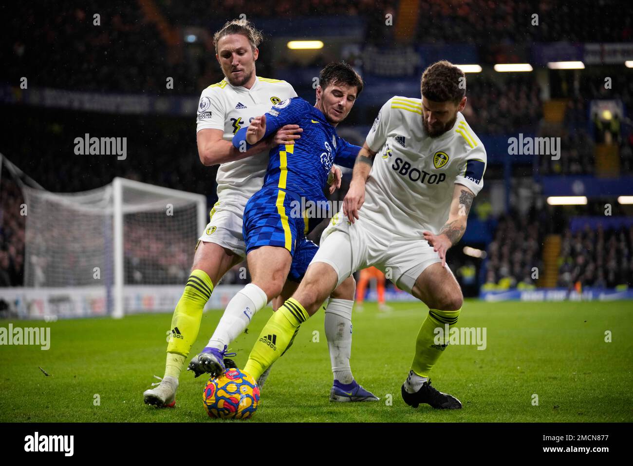 Chelsea's Mason Mount, center, challenges for the ball with Leeds ...