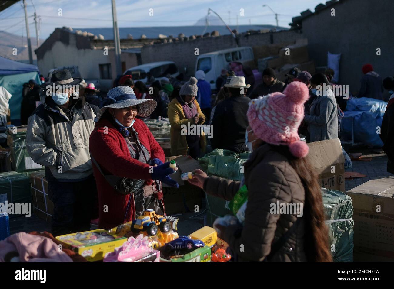 People, mostly from Bolivia, sell and buy goods at a market in the ...