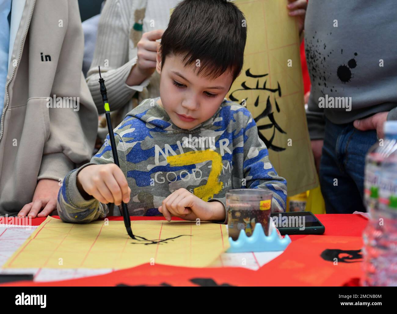 Moscow, Russia. 21st Jan, 2023. A boy learns calligraphy during a ...