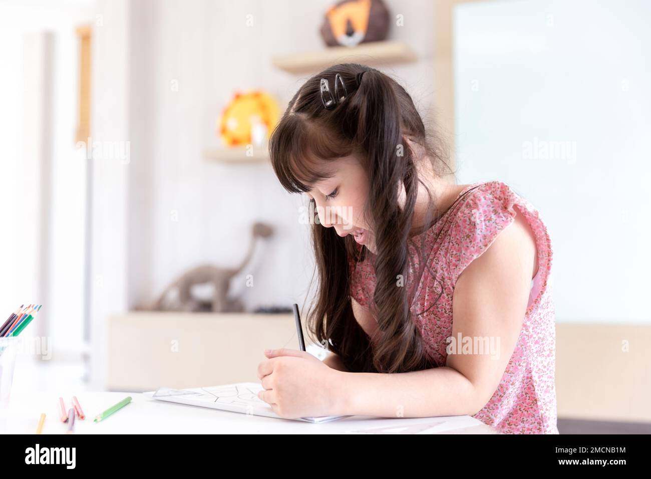 happy smiling young asian student student girl with colour pencil for ...