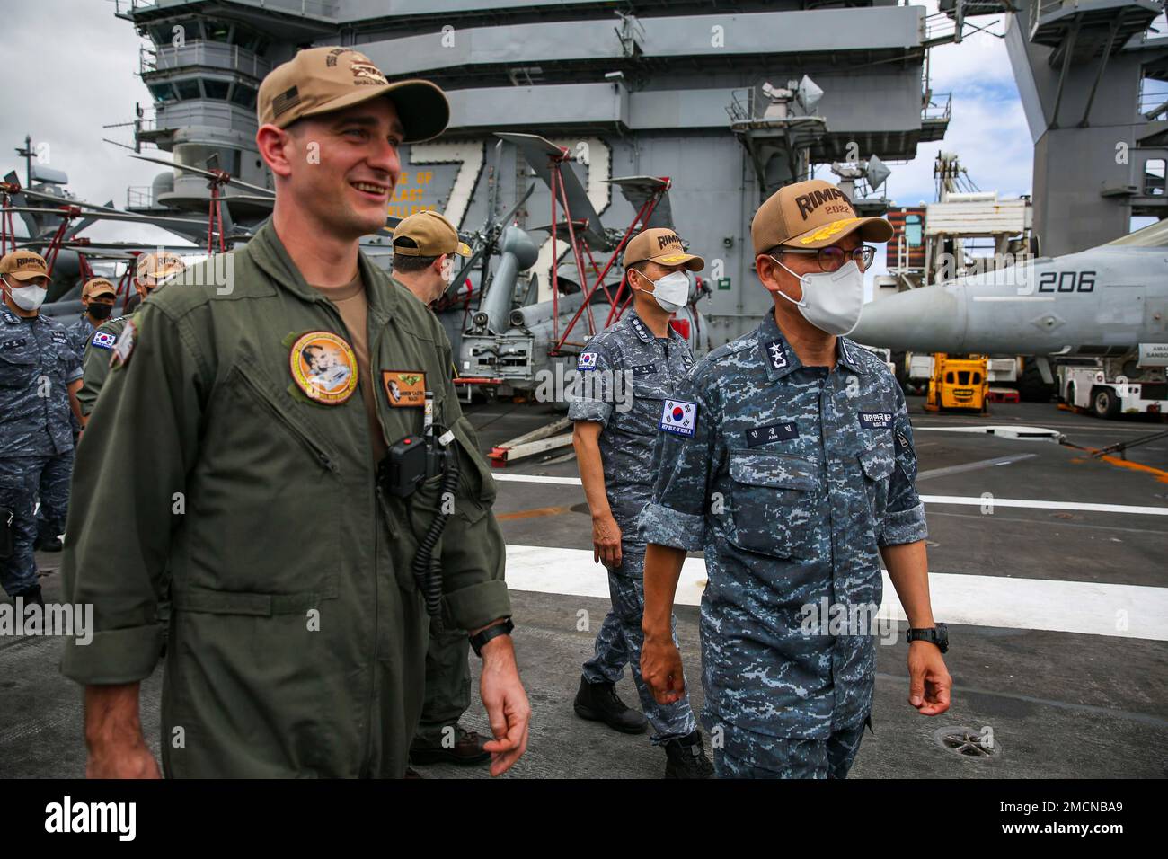 220707-N-VI910-1153 PEARL HARBOR (July 7, 2022) Lt. Andrew Castro, left ...