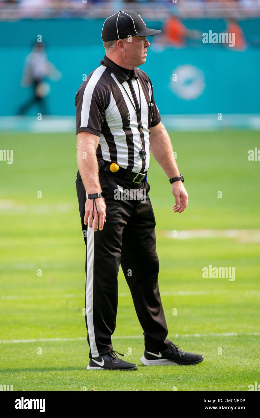 NFL down judge Danny Short stands on the field during an NFL football ...