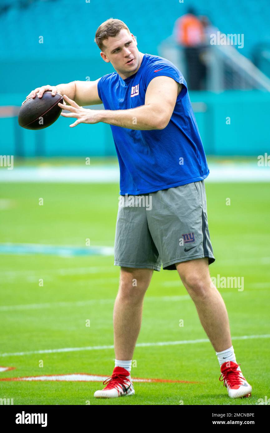 New York Giants tight end Jake Hausmann (49) throws a football on the ...