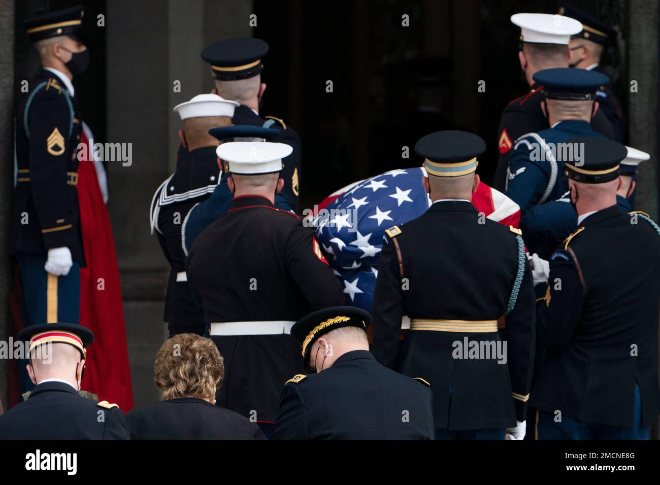 The flag-draped casket of former Sen. Bob Dole of Kansas, is carried ...