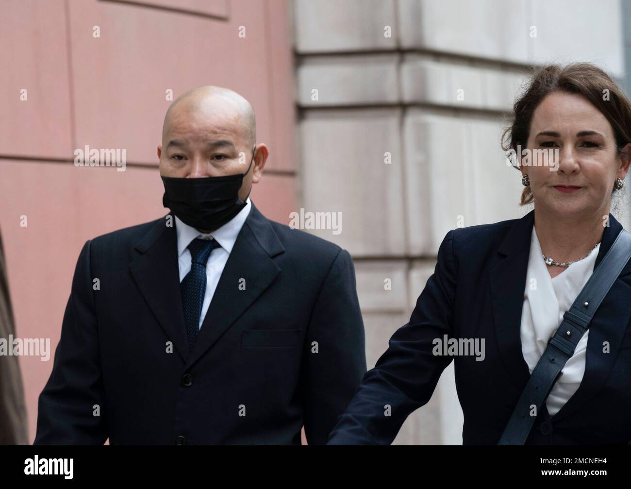 Former Houston Police Officer, Tam Dinh Pham, left, arrives for sentencing at the federal ...