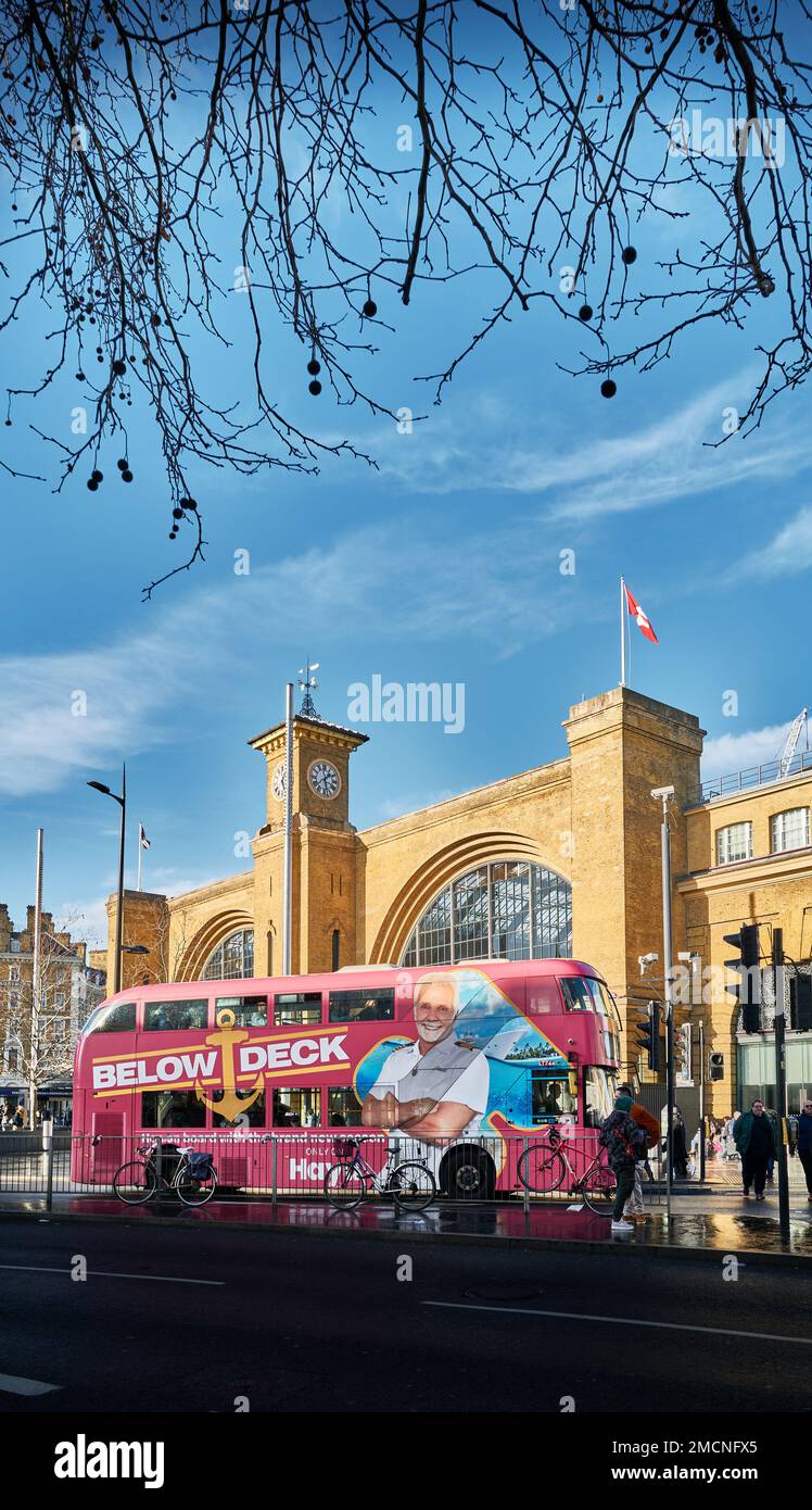 Bus outside the victorian facade of King's Cross rail station, London ...