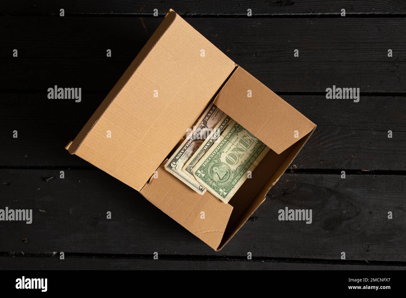 Money in the box hi-res stock photography and images - Alamy