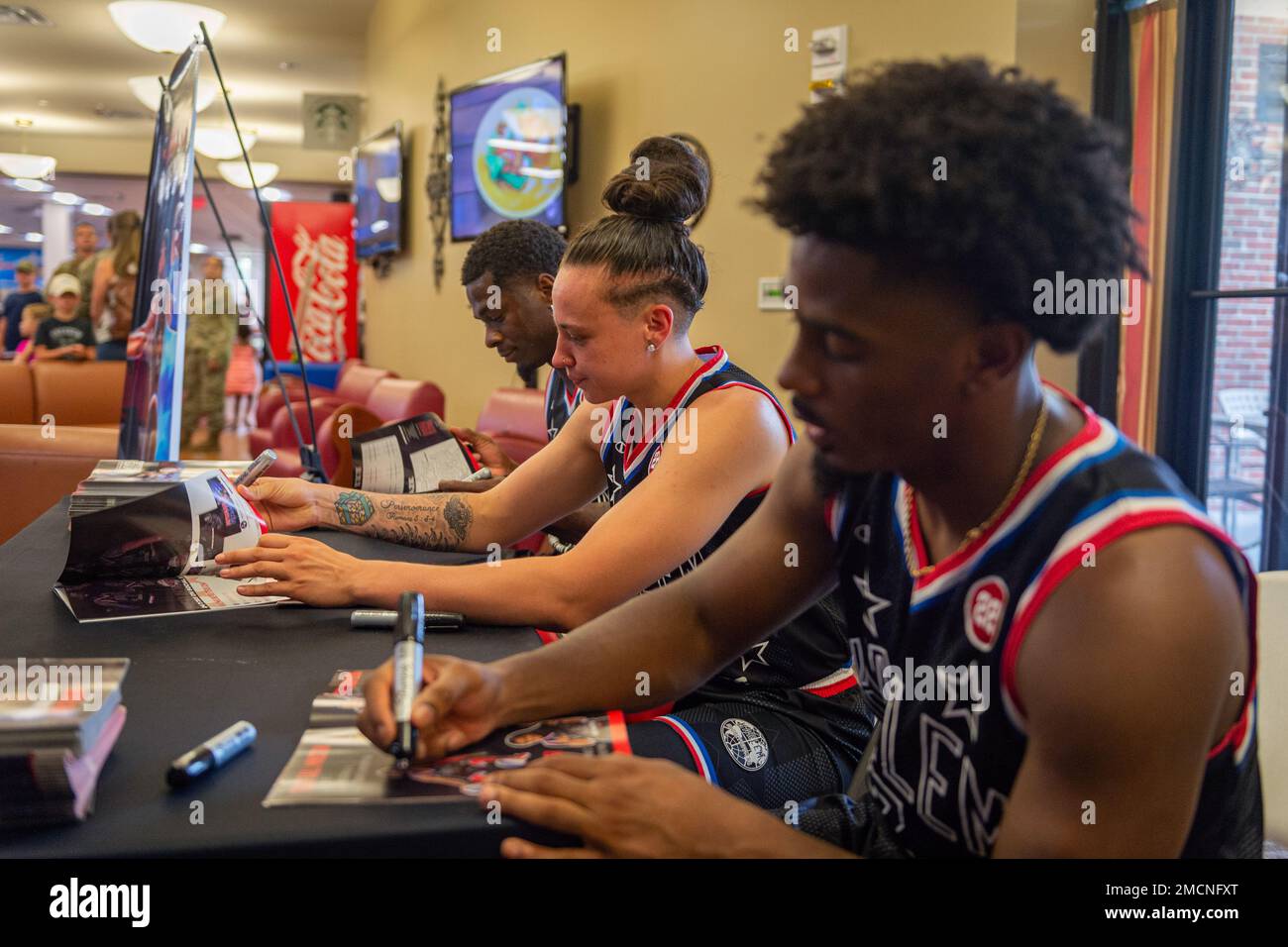 Lucius “Too Tall” Winston, right, Mia “Mighty” Hopkins, center, and ...