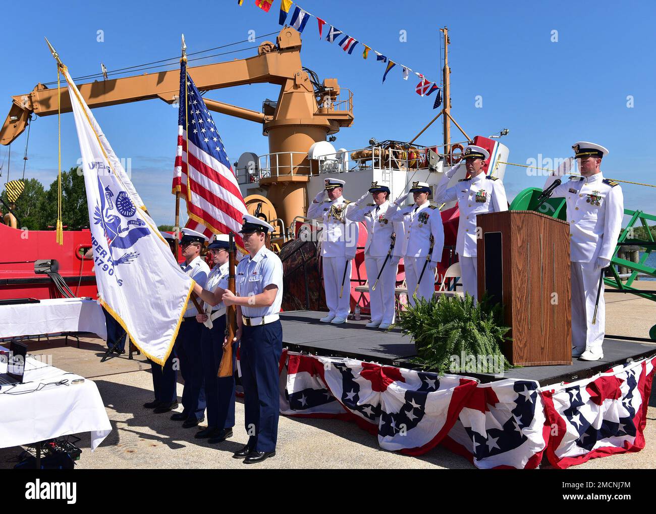 A color guard from the Coast Guard Cutter Mackinaw presents the colors ...