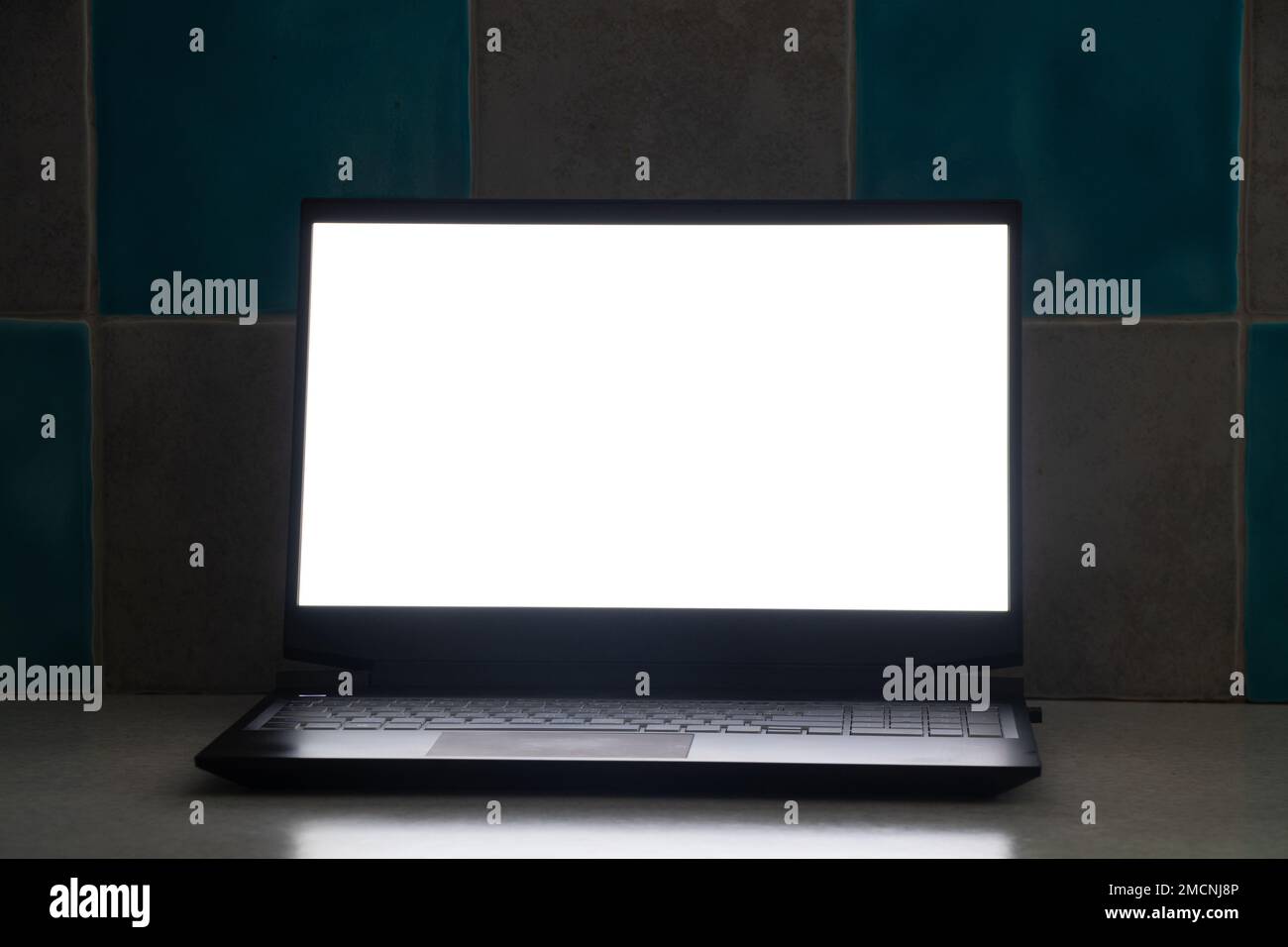 laptop with white screen stands at work place on table at home, laptop ...