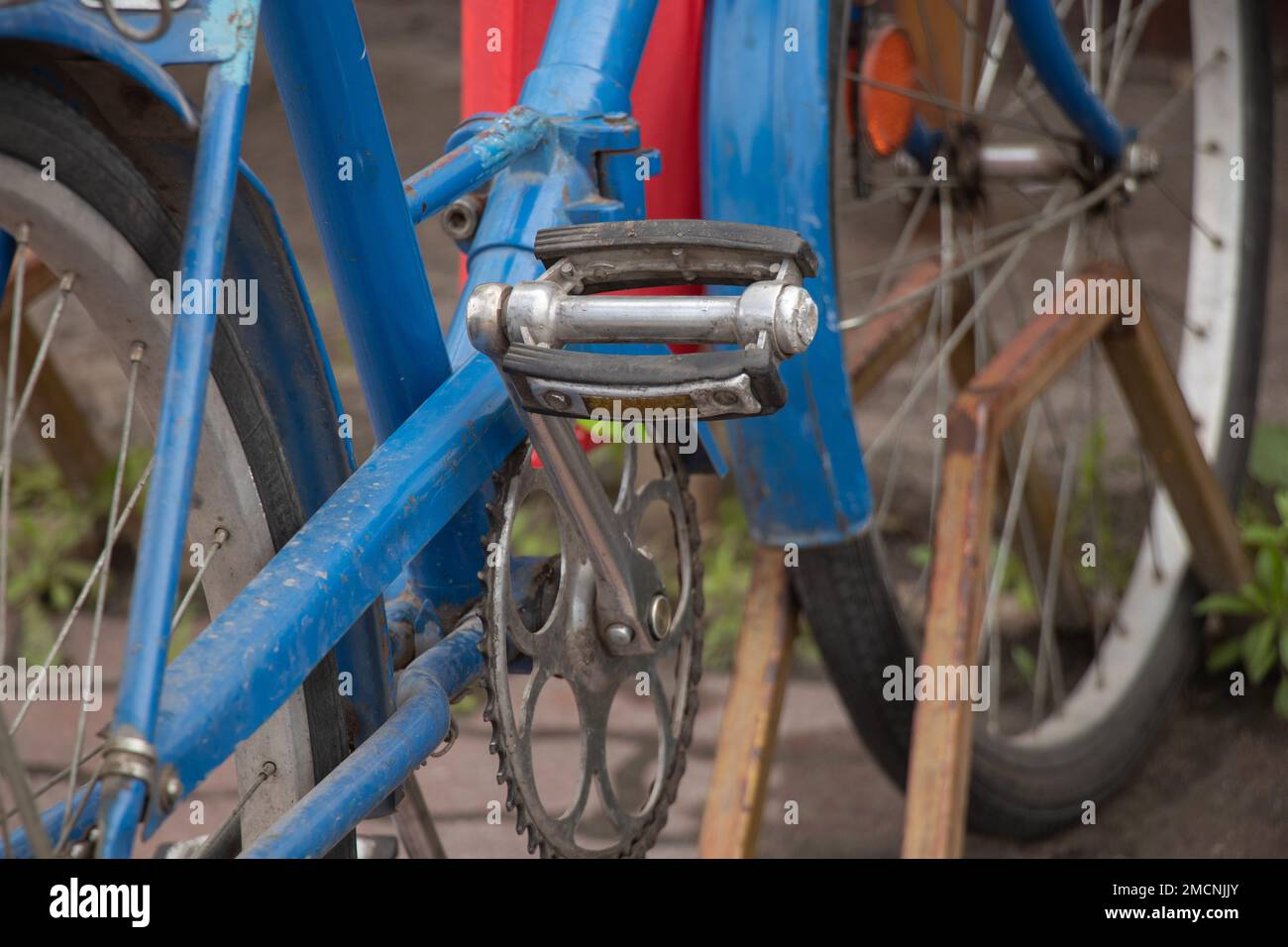 old blue bicycle stands in the yard close-up, retro bicycle Stock Photo ...