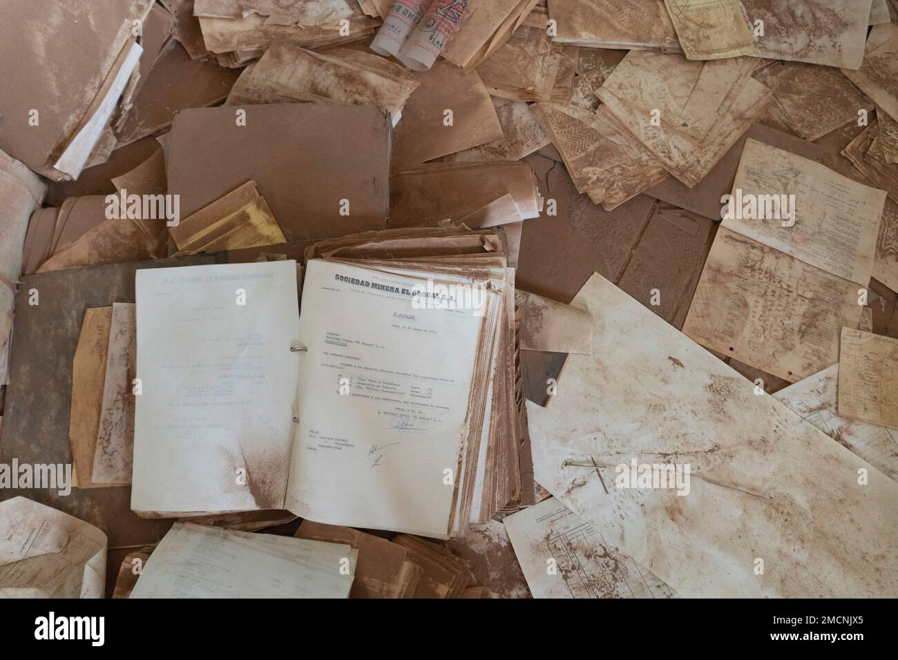 Business papers litter the floor at an abandoned office of a mine that ...