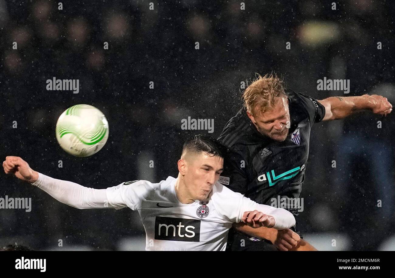 Partizan's Slobodan Urosevic, left, duels for the ball with Anorthosis ...