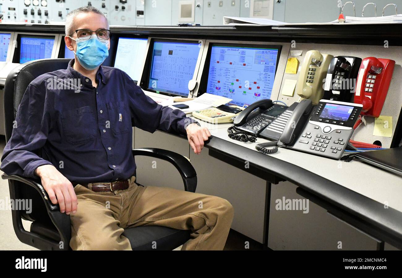 Kevin Herr, Powerplant Shift Operator, sits in the control room of the ...