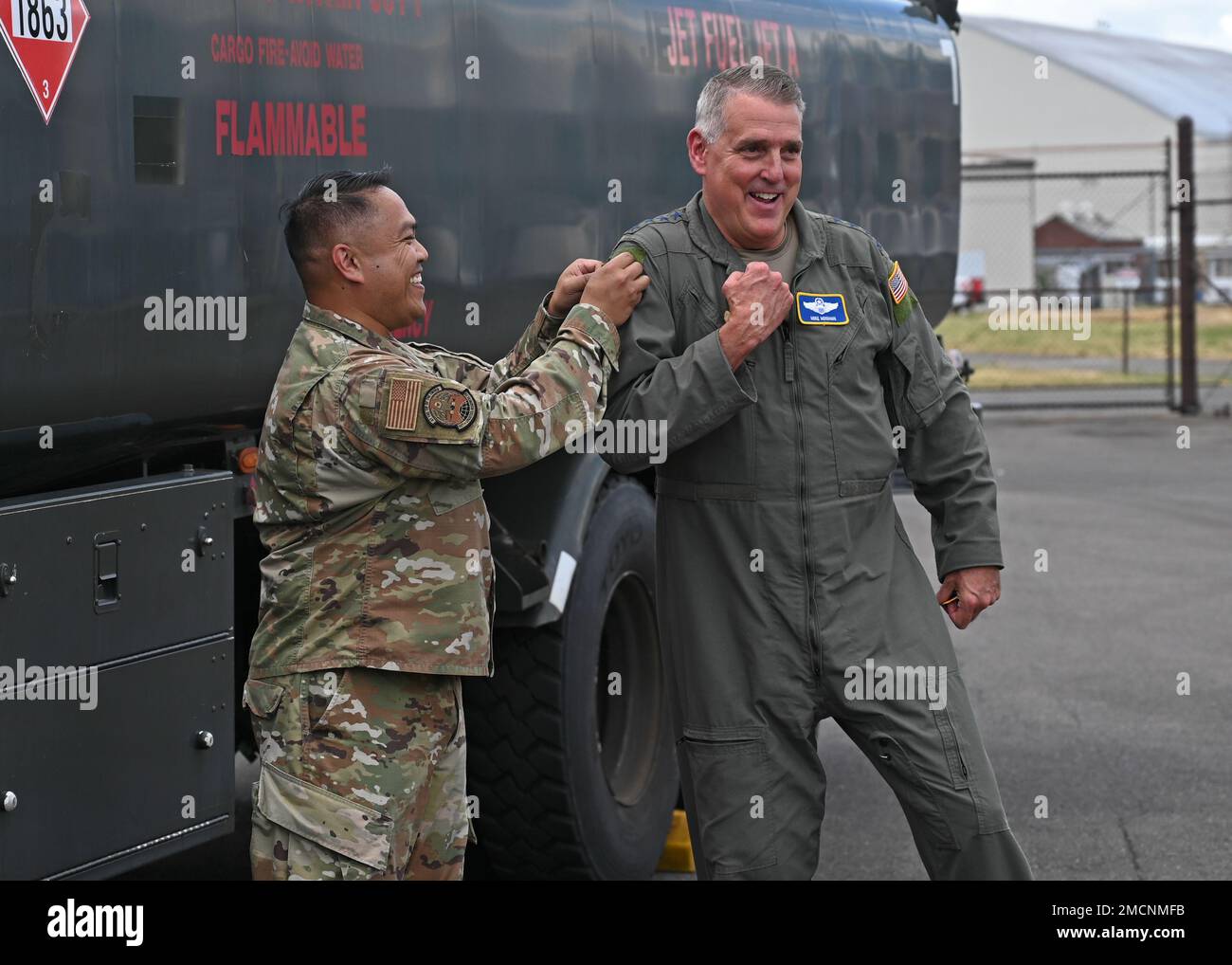 U.S. Air Force Tech. Sgt. Jeffrey Panen, left, fuels service center NCO ...