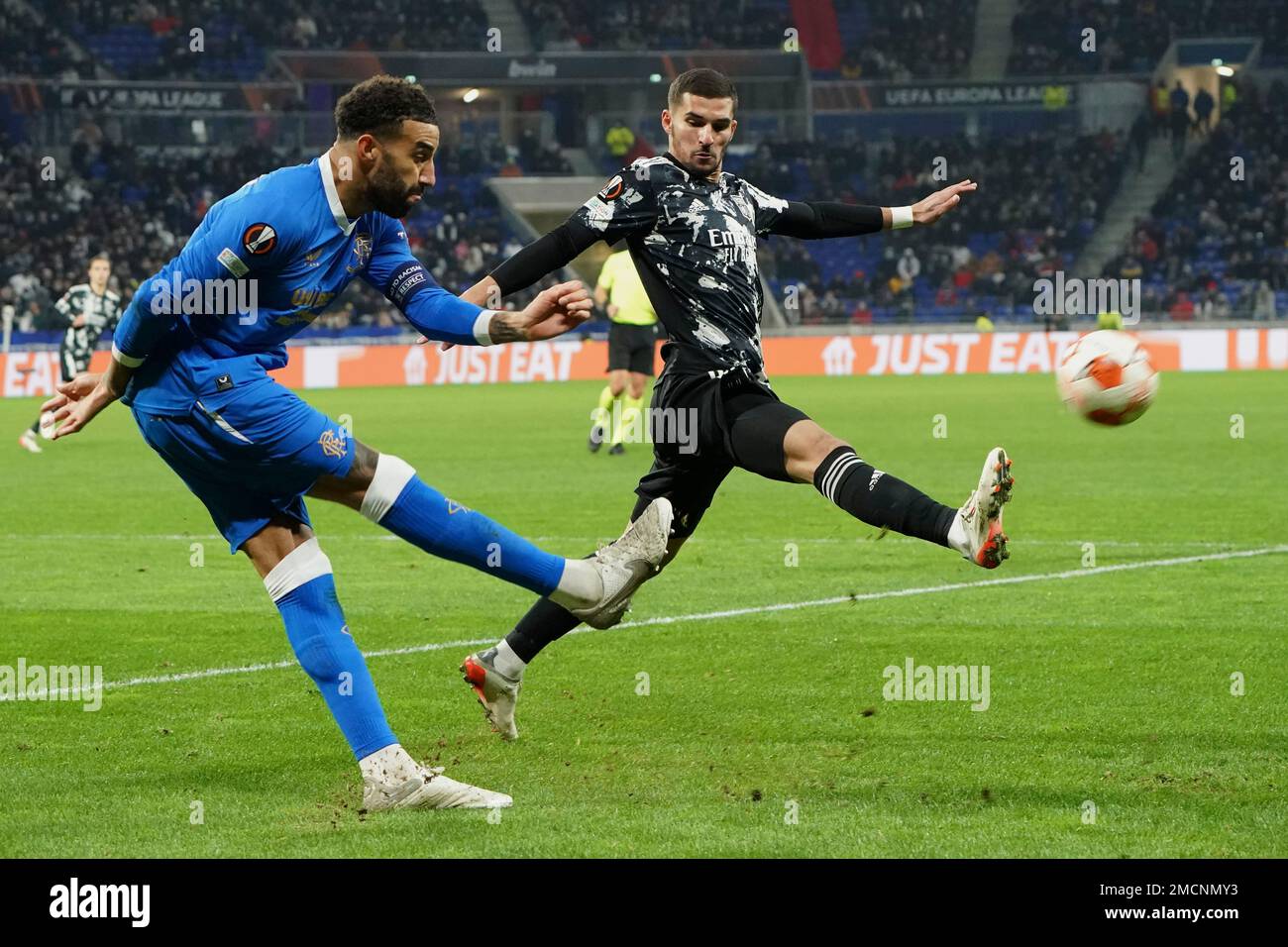 Rangers' Connor Goldson, left, and Lyon's Houssem Aouar challenge for ...