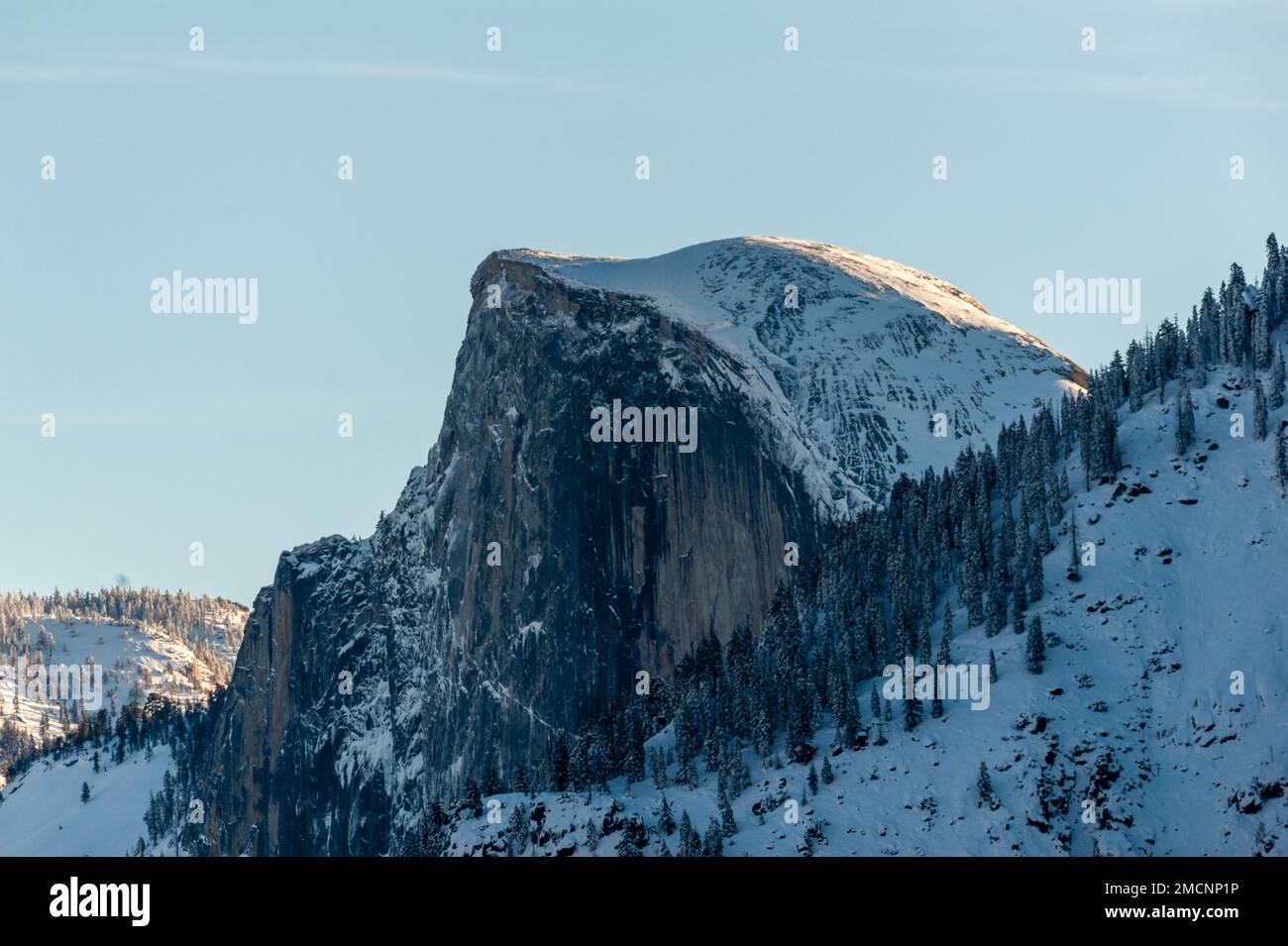 The first rays of the morning sun reflect off the rocks of the Sierra ...