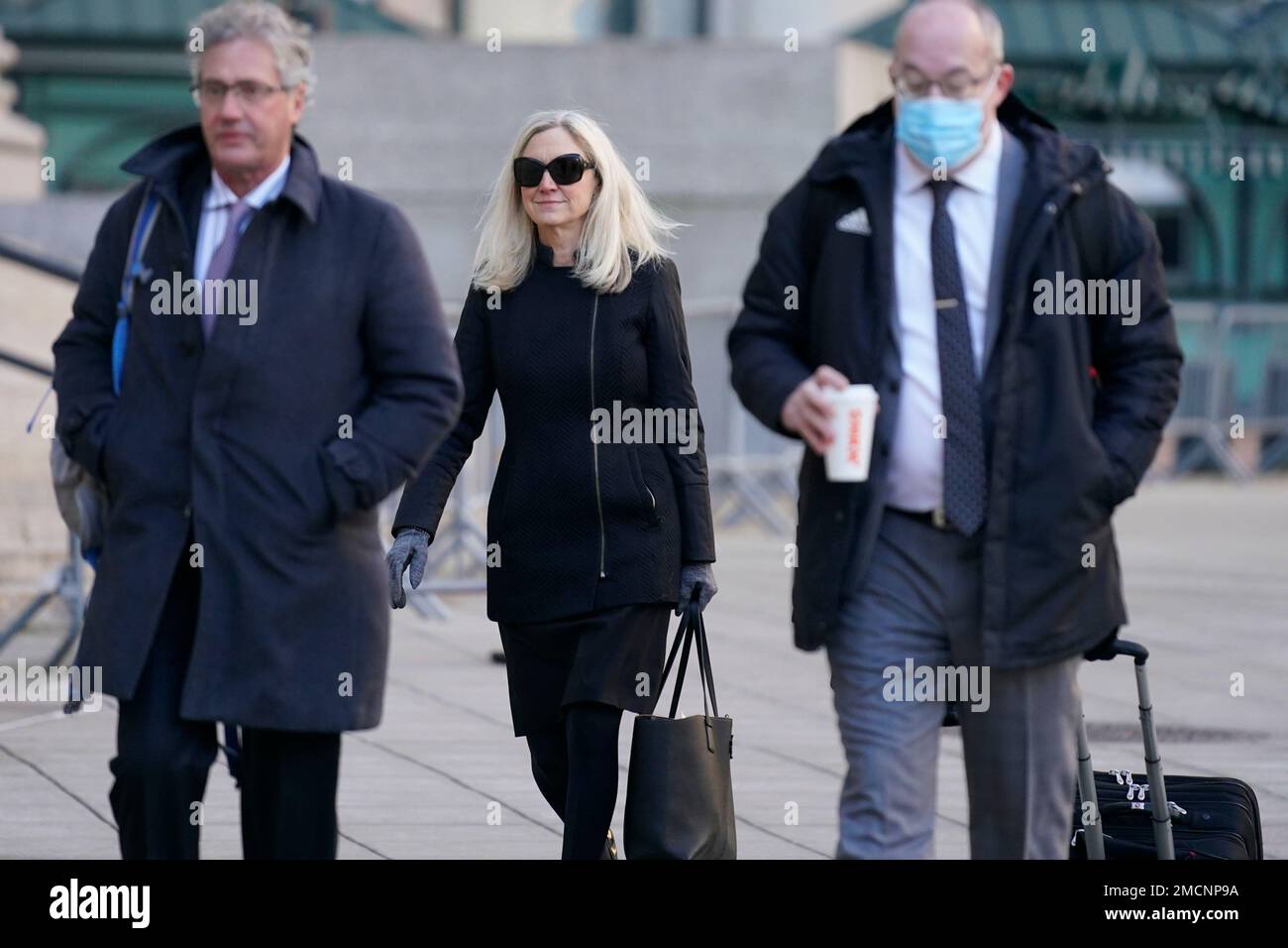 Attorney Laura Menninger, center, arrives to the courthouse in New York ...